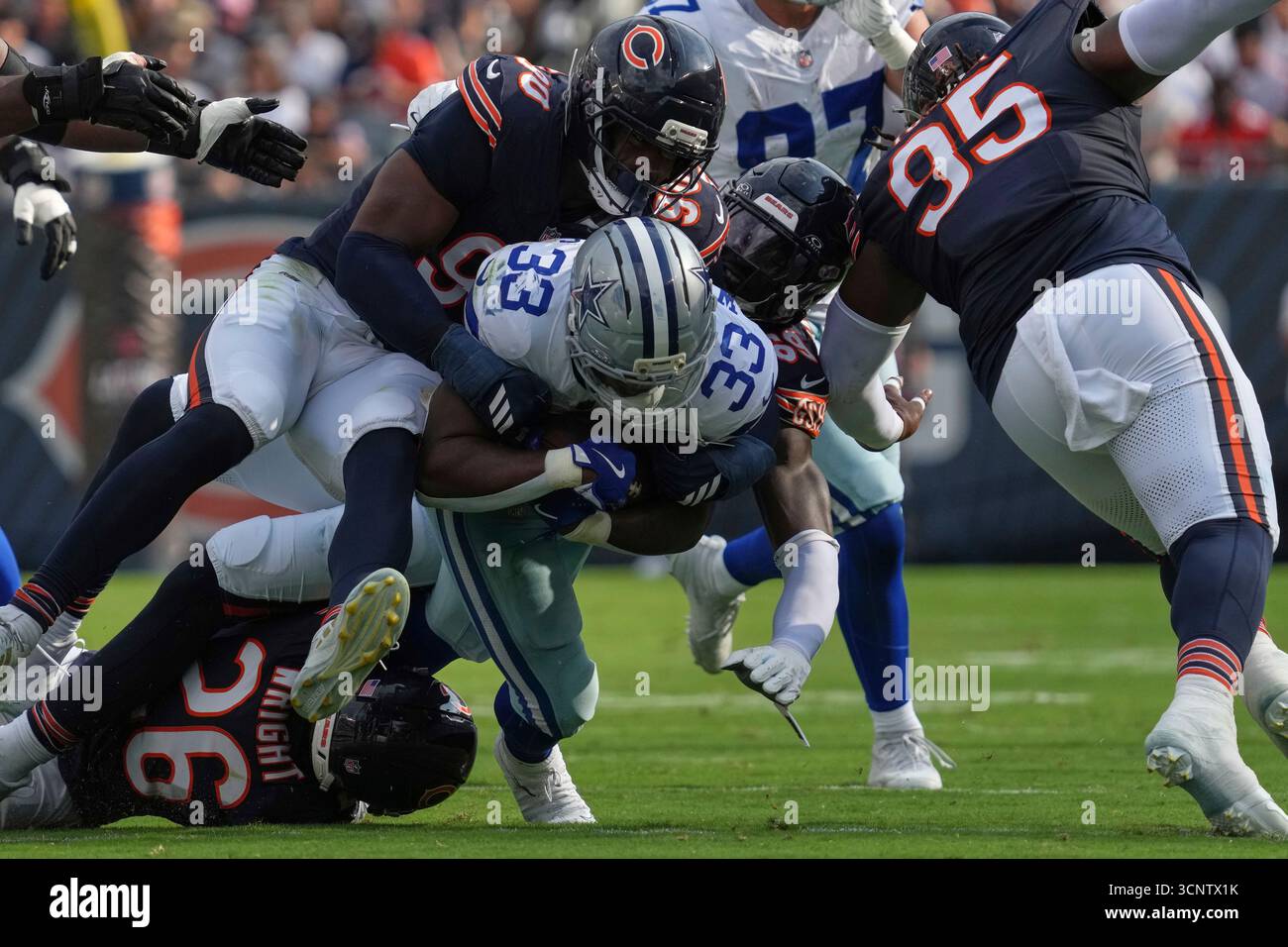 Dallas Cowboys running back Javonte Williams (33) is tackled by Chicago ...