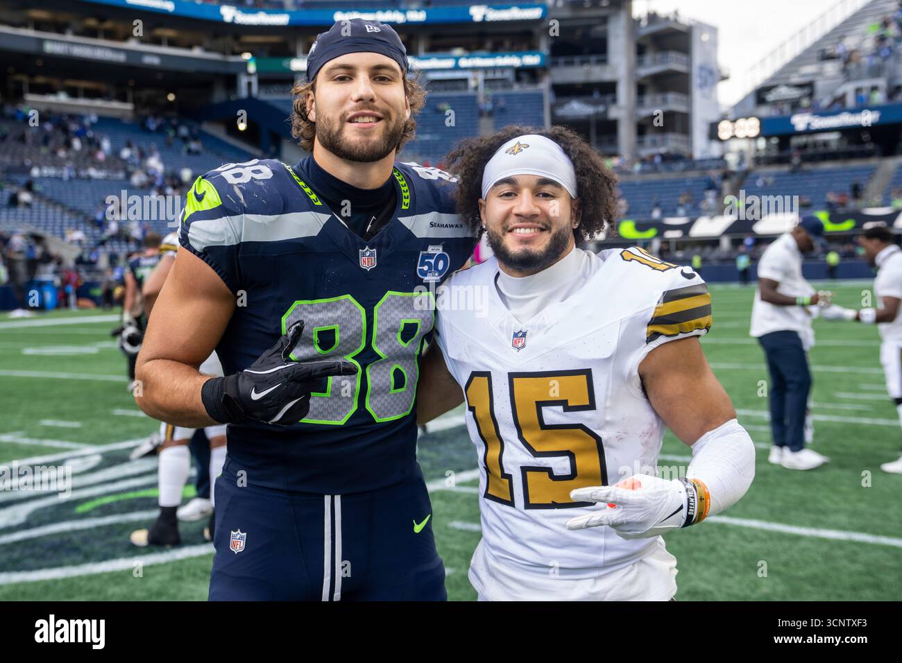 Seattle Seahawks tight end AJ Barner, left, and New Orleans Saints wide ...