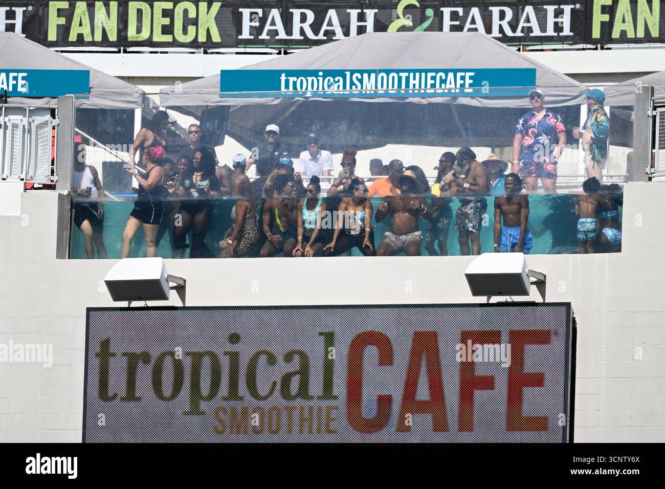 Spectators look on from the stadium pool during the second half of an ...