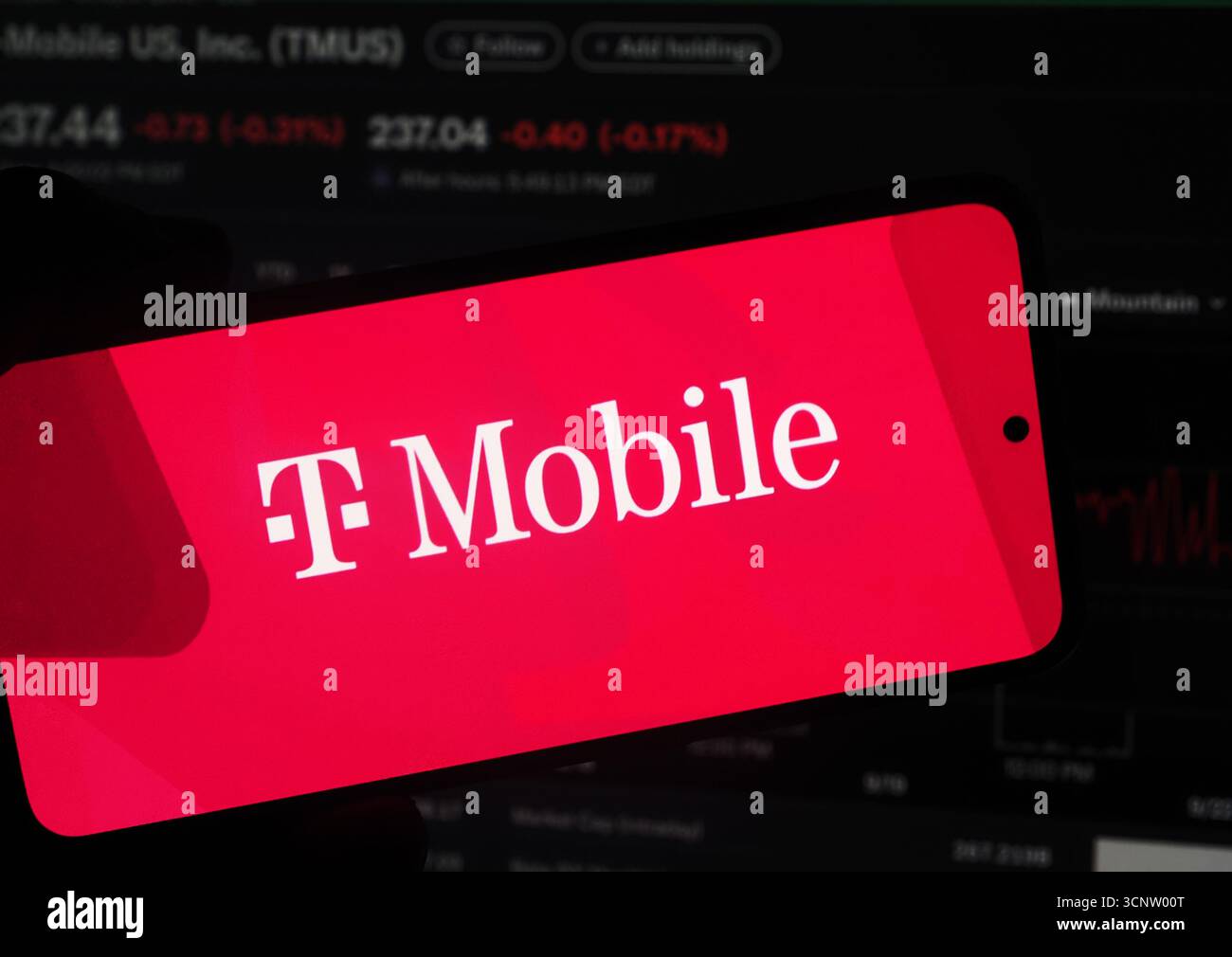In this photo illustration, the T-Mobile logo is displayed on a ...