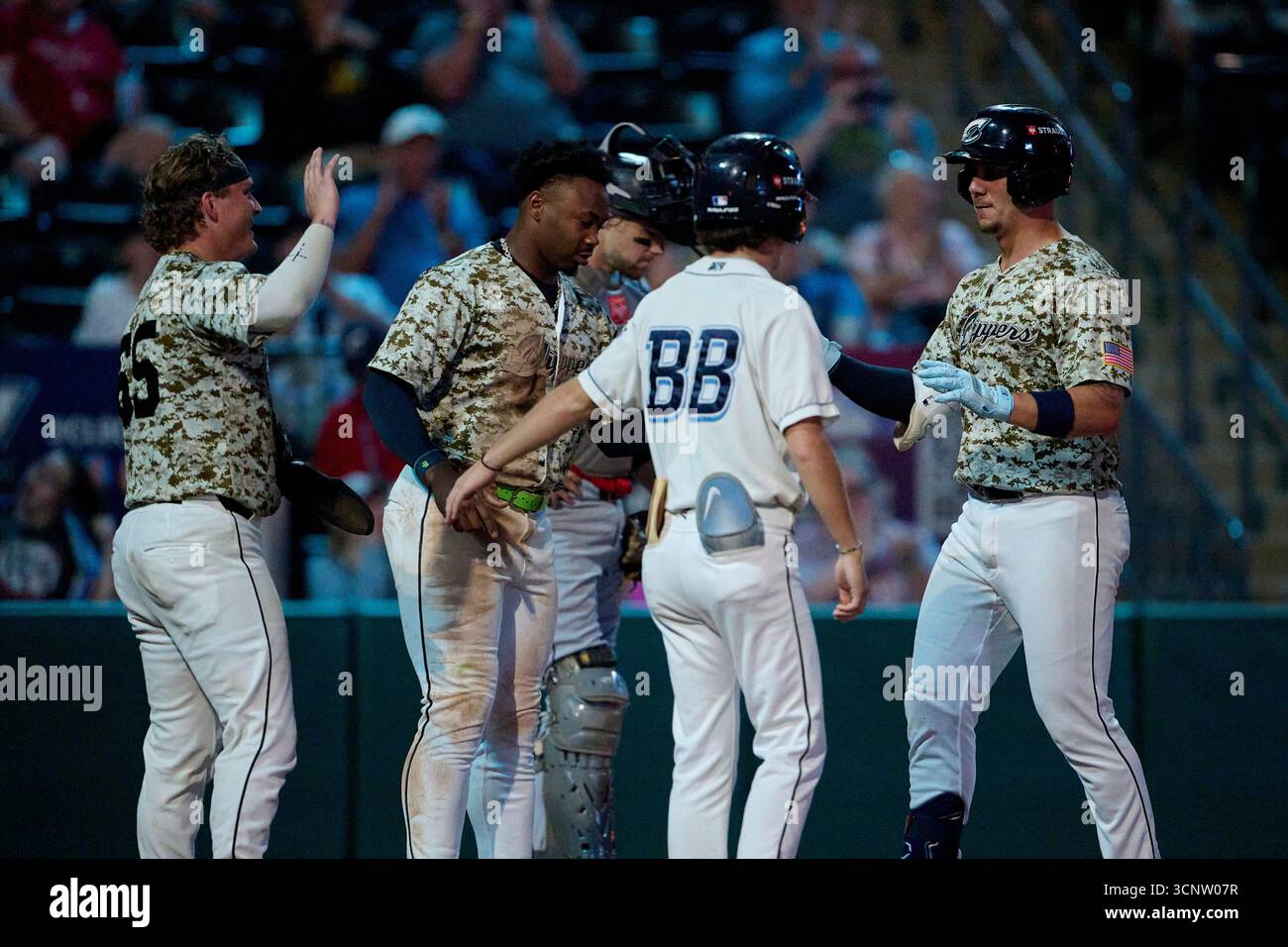 Columbus Clippers Dom Nuñez (11) celebrates with Kahlil Watson (9) and ...