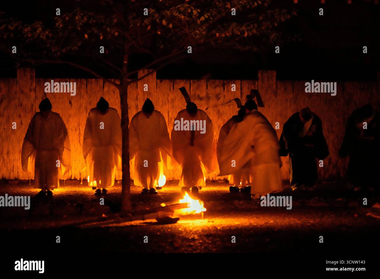 Shinto priests participate in Konomotosai, a night ceremony of the ...