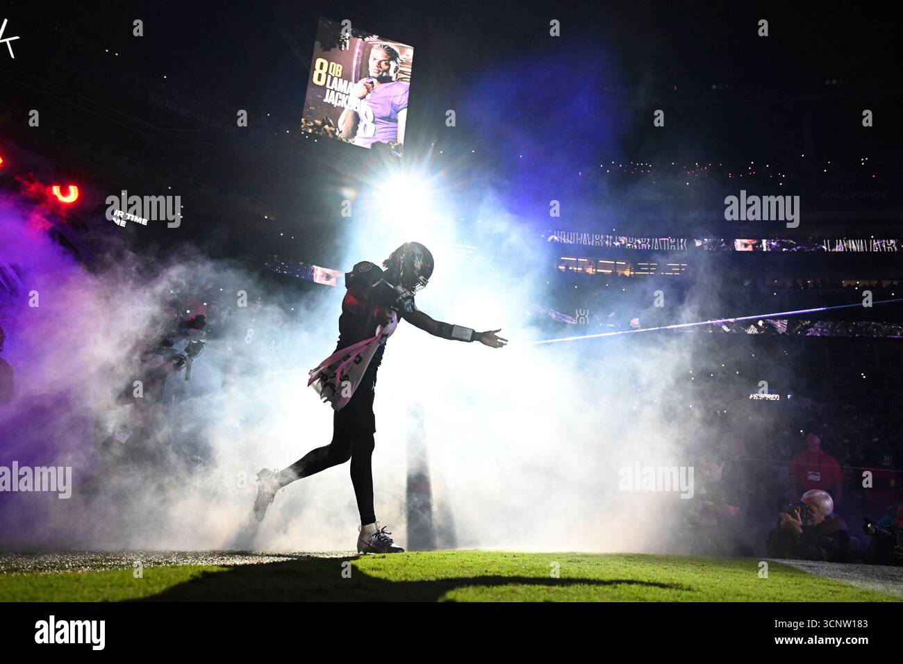Baltimore Ravens quarterback Lamar Jackson runs onto the field during ...