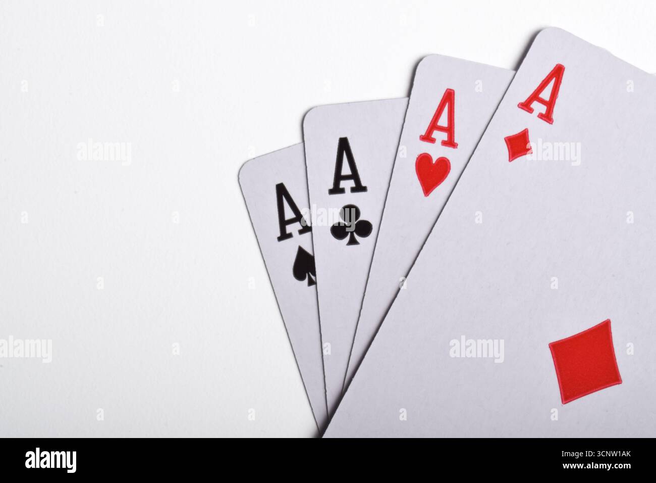 Close up of four aces playing cards suits isolated on white background ...