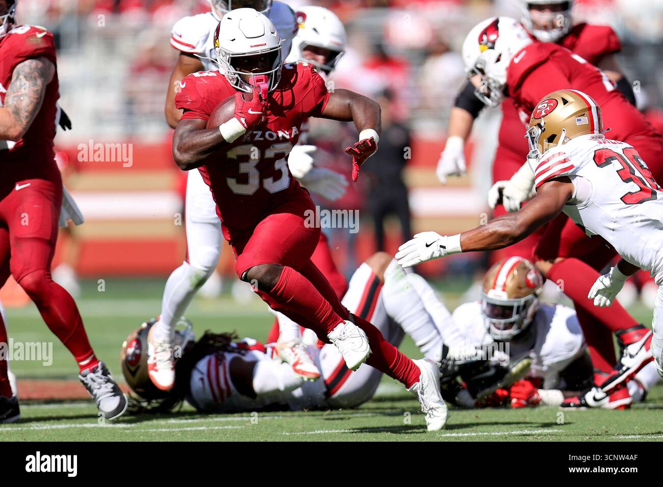 Arizona Cardinals running back Trey Benson (33) runs during an NFL ...