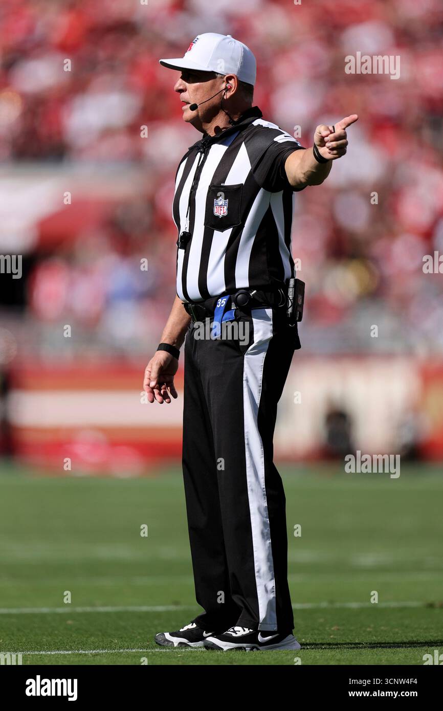 Referee John Hussey (35) signals during an NFL football game between ...
