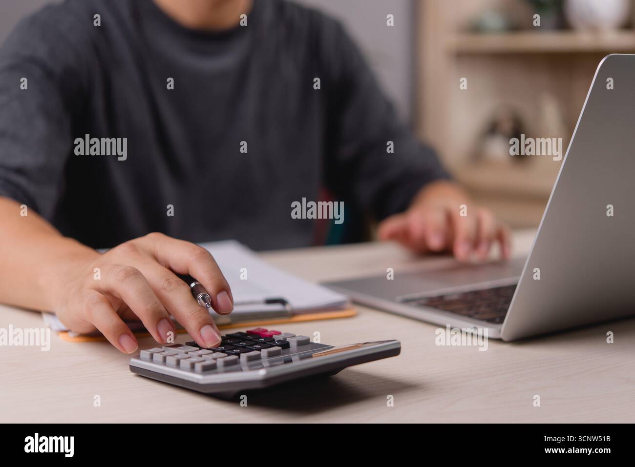 Businessman using calculator bookkeeping payroll and budget tax ...