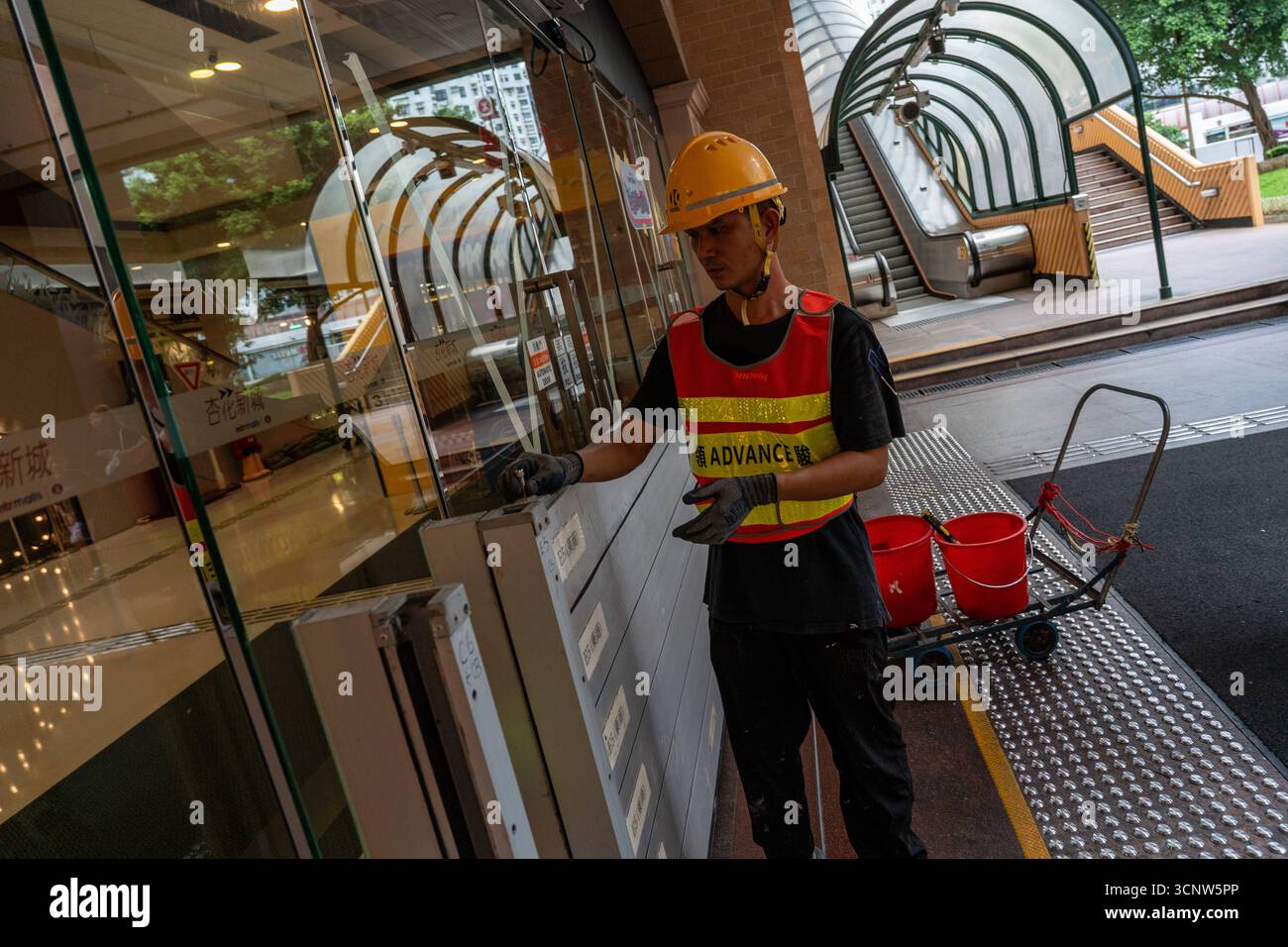 Hong Kong Prepares for Typhoon Ragasa Workers installing water ...