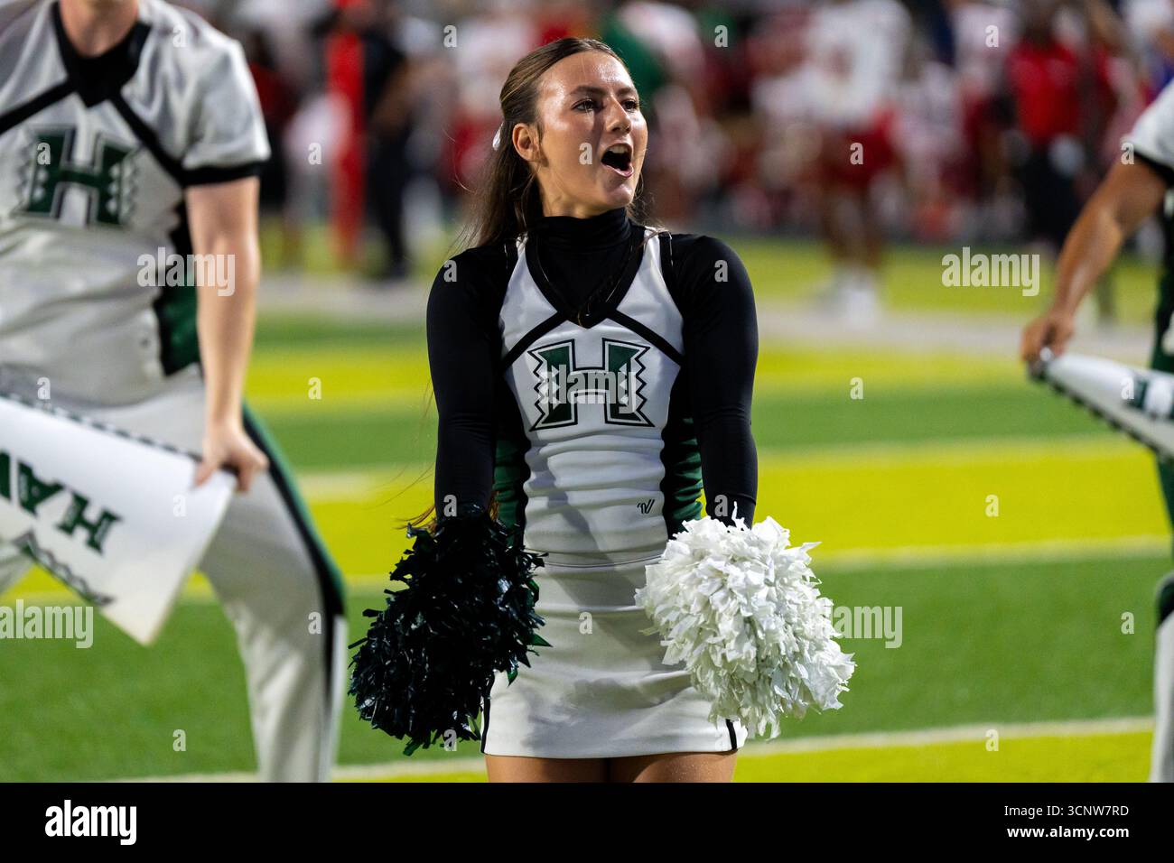 University of Hawaii’s female athlete cheerleaders rally the crowd with ...