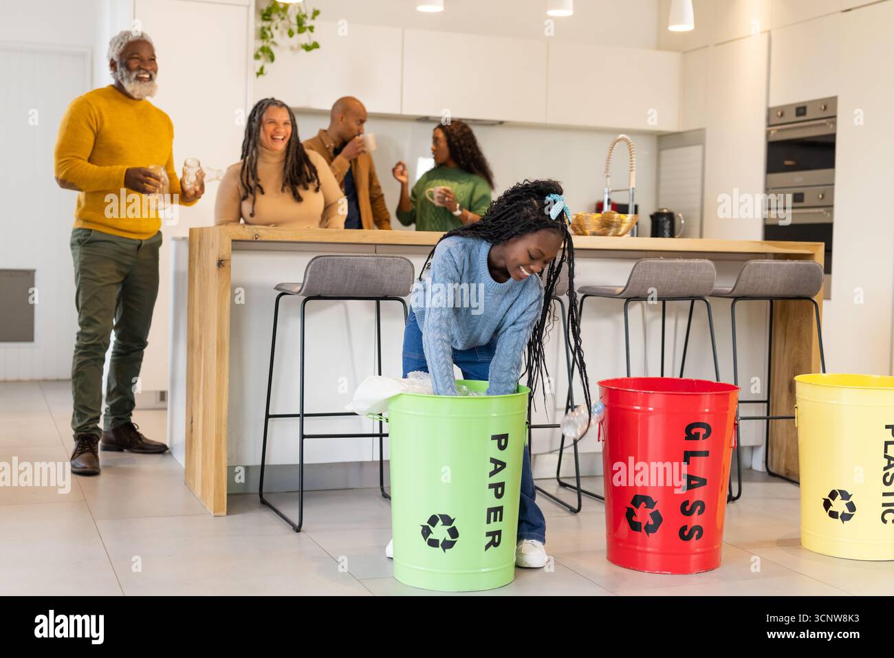 Diverse family sorting bins in hi-res stock photography and images - Alamy