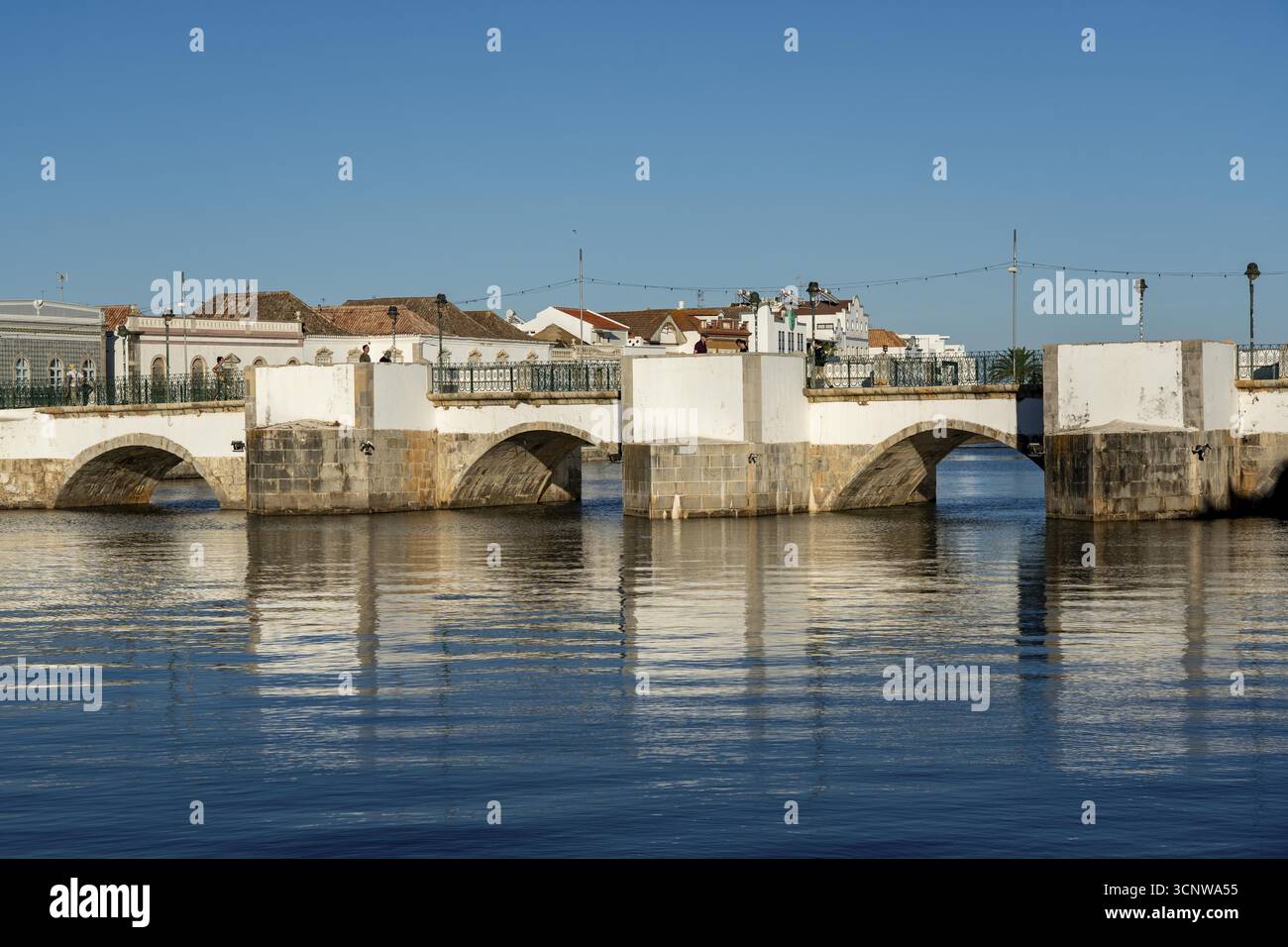 The seven-arched bridge over the Rio Gilao, in Tavira, old town, in the ...
