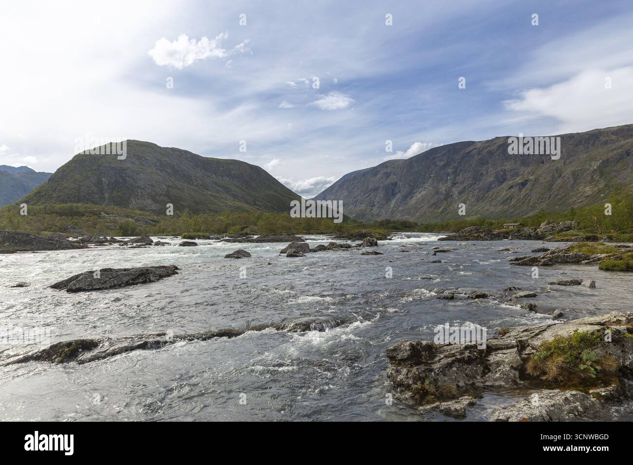 River Sjoa in front of the rock face of Mount Besseggen, Jotunheimen ...