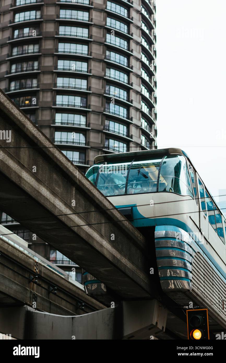 The image captures the iconic Seattle monorail gliding past a striking ...