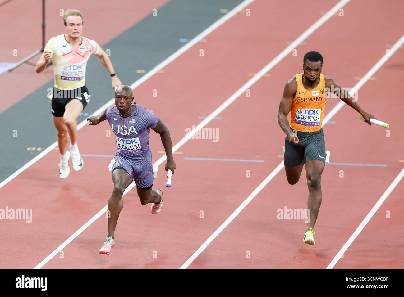T’Mars McCallum (USA) brings the baton to the finish of the 4 x 100 ...