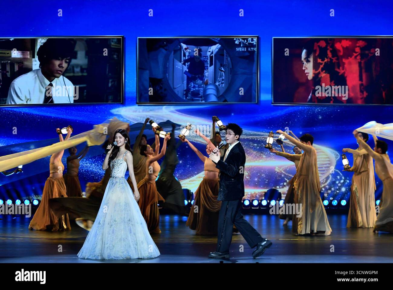 Actress Xue Ruohan (L) and singer Jiao Maiqi sing a song at the opening ...
