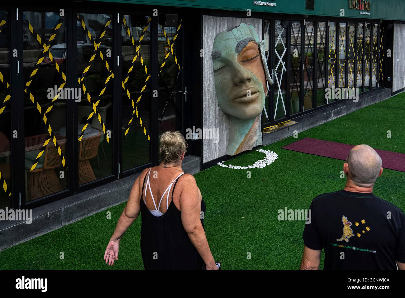 Taped-up windows are seen at a restaurant ahead of super typhoon Ragasa ...