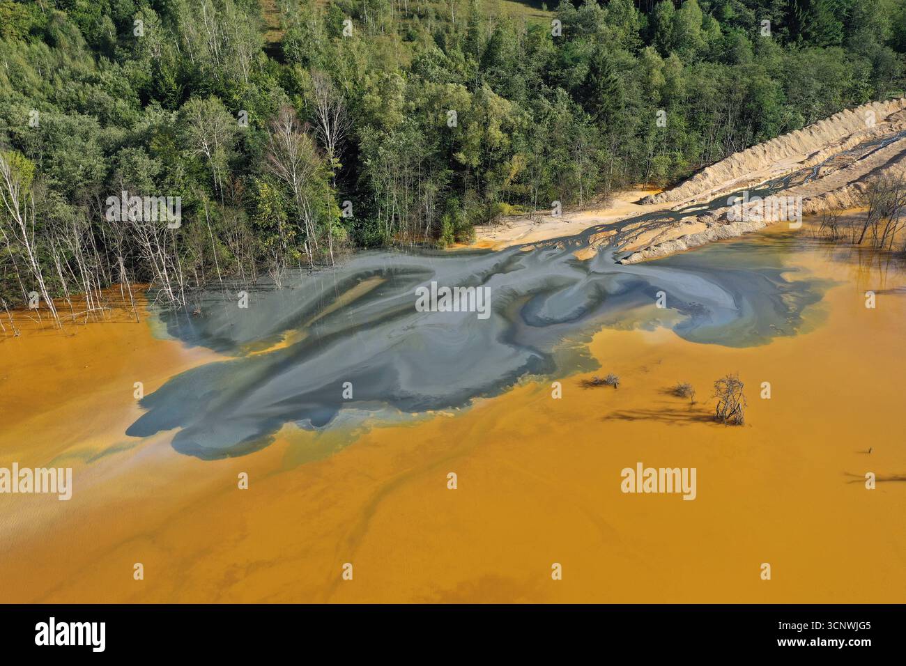 Flying over surreal patterns of flowing colorful mining chemical ...