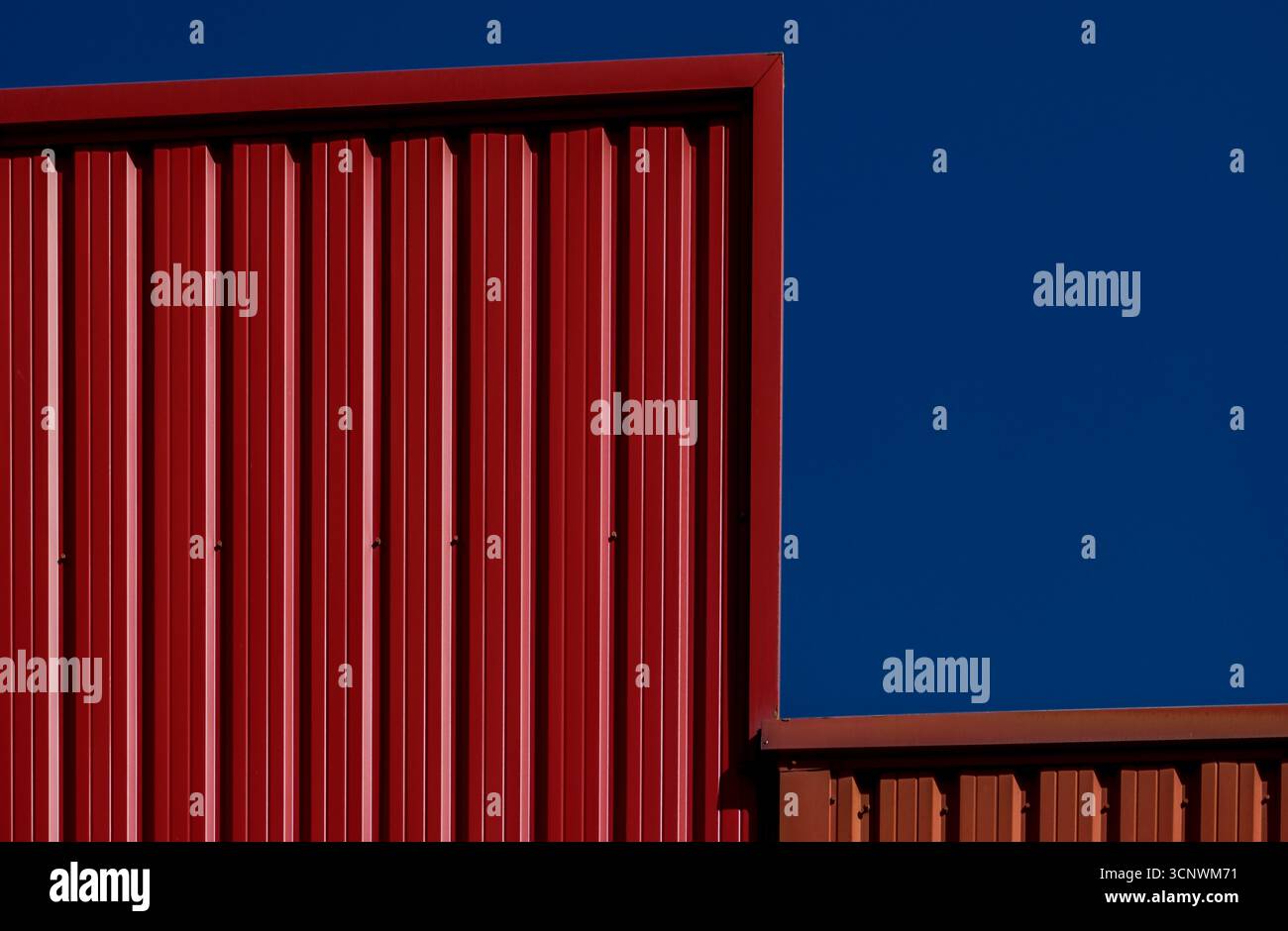 A striking image of modern architecture featuring red vertical facades ...