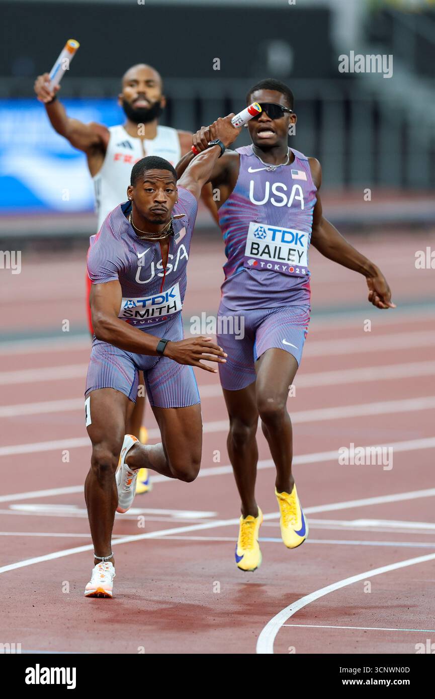 Christopher Bailey (USA) hands the baton off to Demarius Smith (USA) in ...