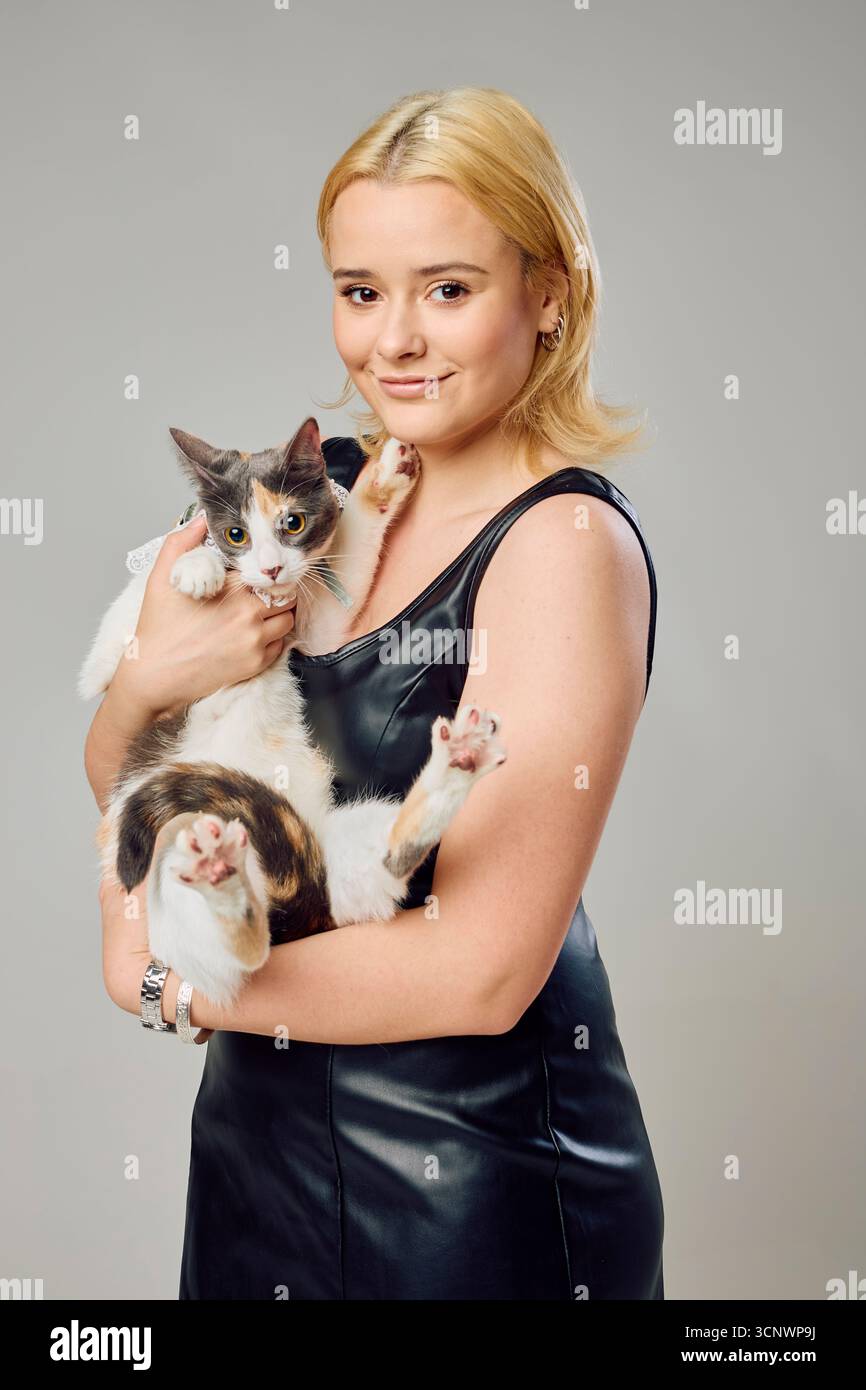 Smiling blonde woman wears hi-res stock photography and images - Alamy