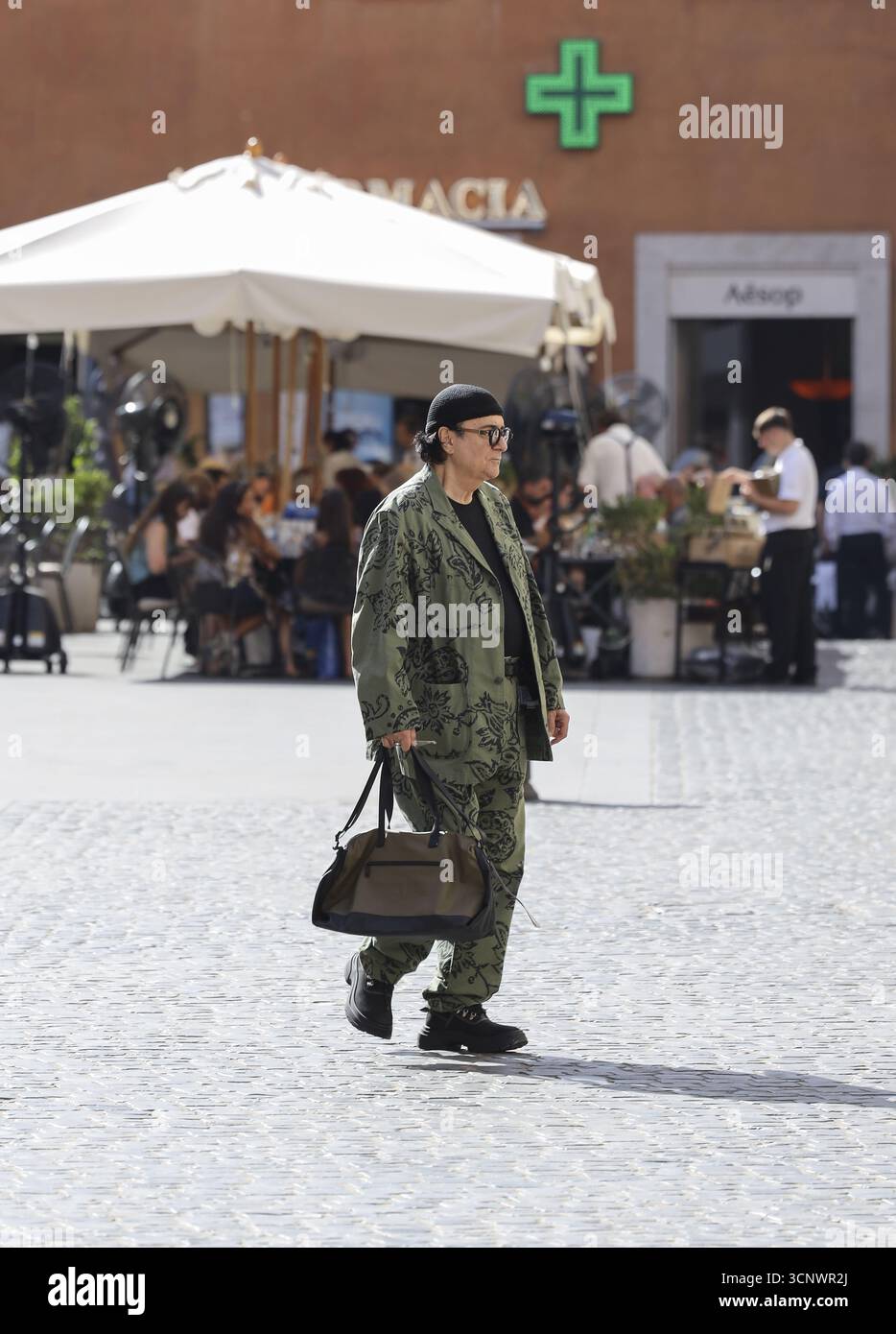 Rome, the famous singer Renato Zero photographed while walking through ...