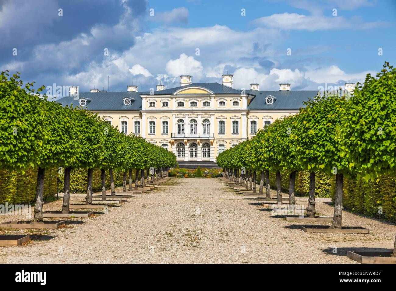 Rundale Palace - Baroque architecture with tree lined alley in the ...