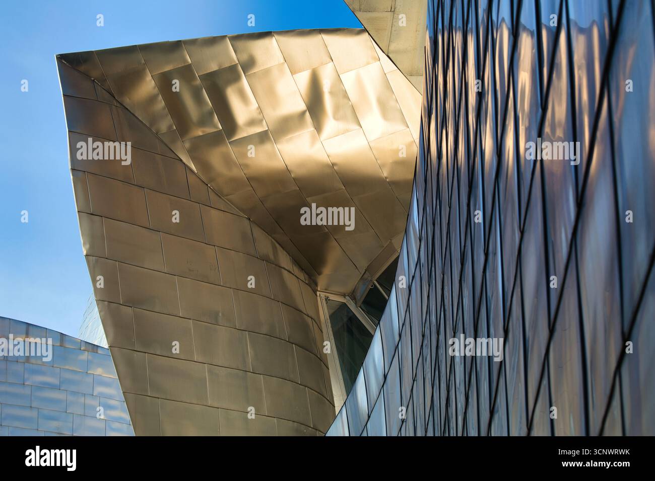 Guggenheim Museum Bilbao under blue sky. - The stunning Guggenheim ...
