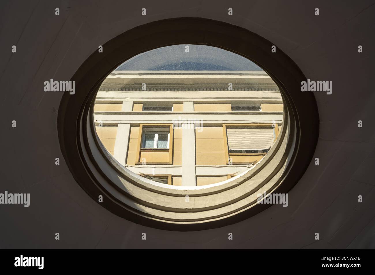 View of a building through a circular skylight Stock Photo - Alamy