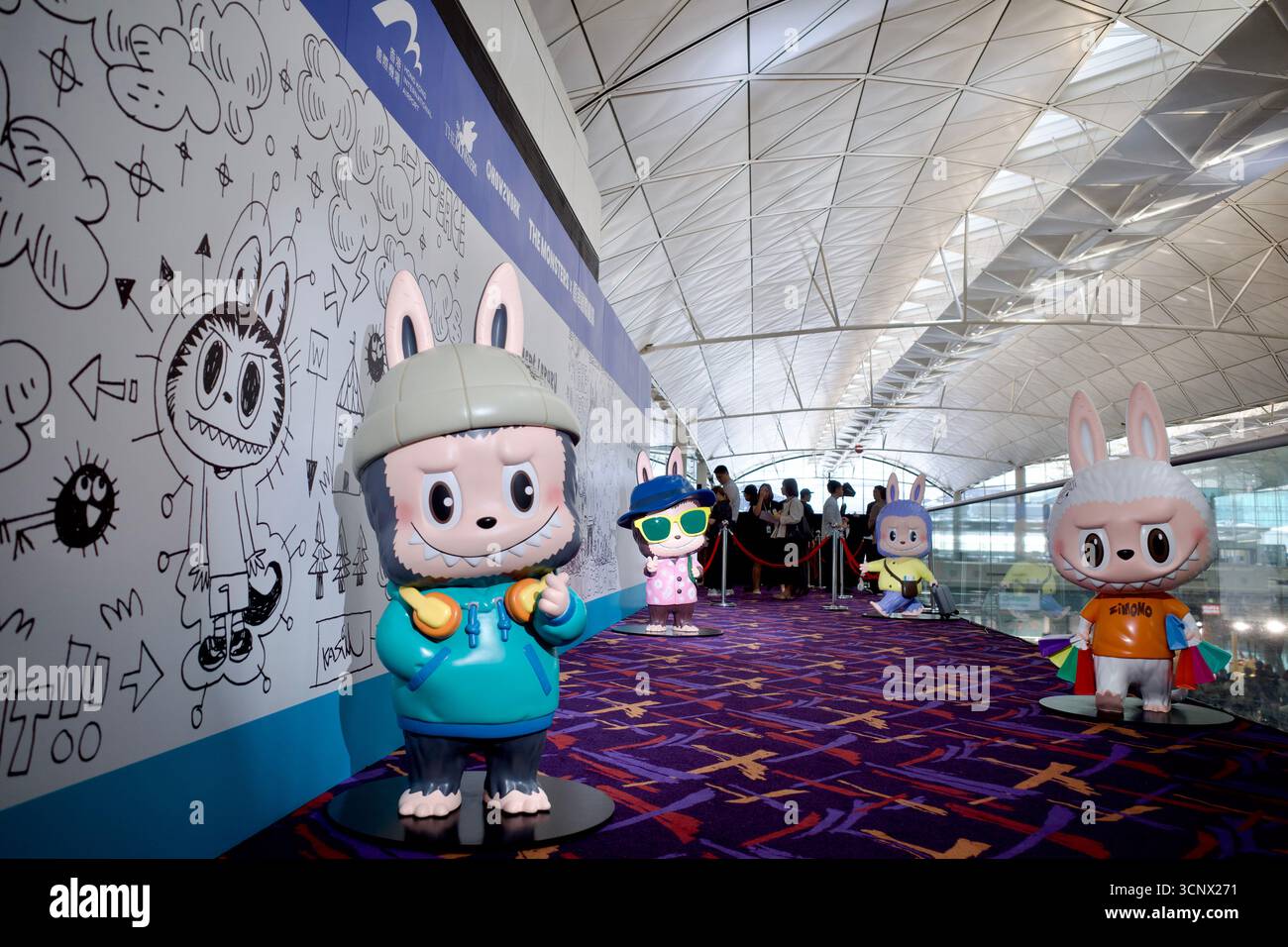 Multiple LABUBU devices are on display in the departure hall of the ...