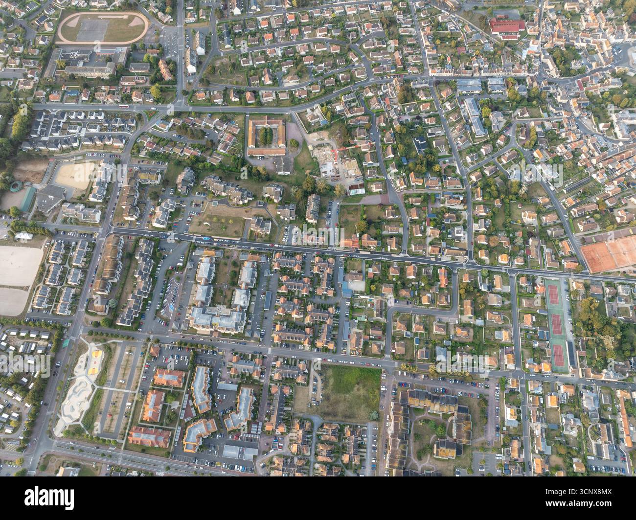 Aerial view of rooftops and tree tops create an intricate tapestry of ...