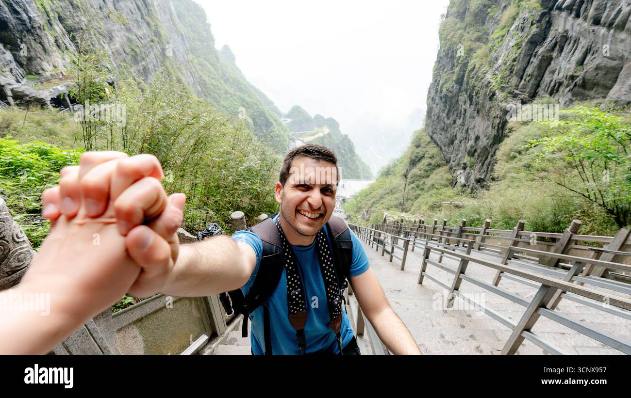 Smiling man reaches the top of the 999 steps known as the Stairway to ...