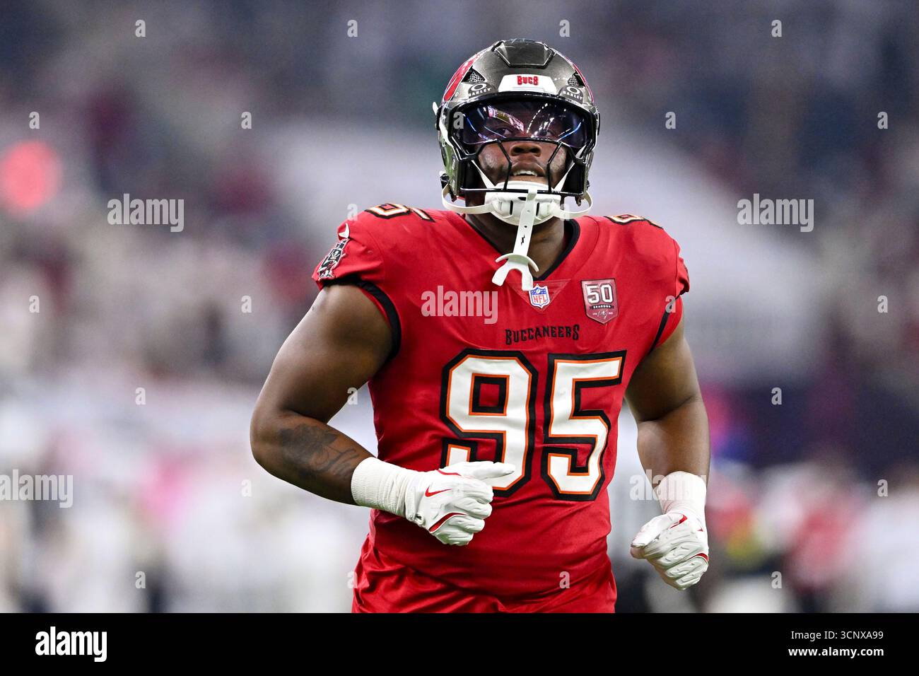 Tampa Bay Buccaneers defensive end Elijah Roberts (95) walks off the ...