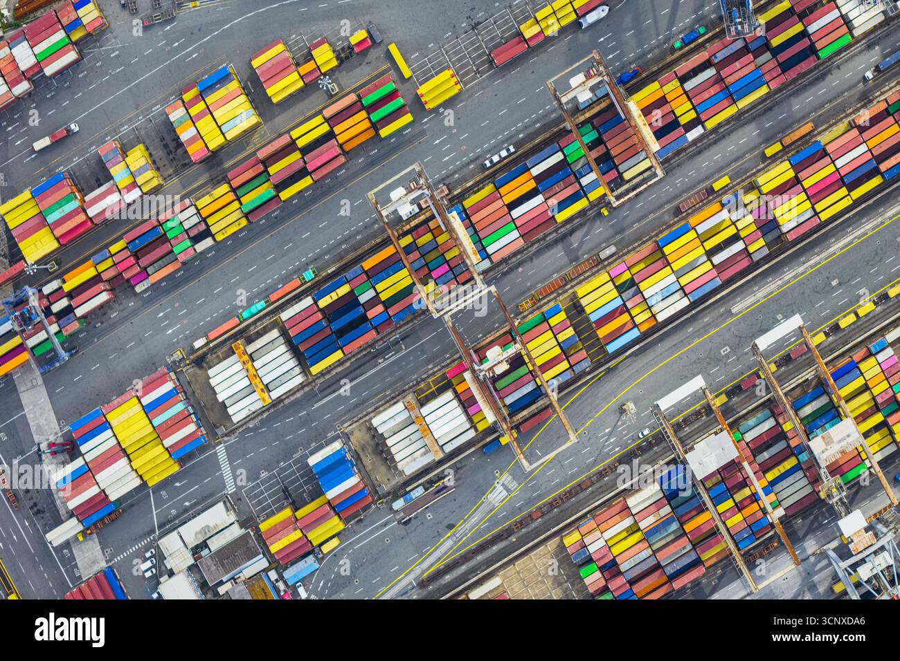 Aerial view of a vibrant tapestry of stacked shipping containers, a ...