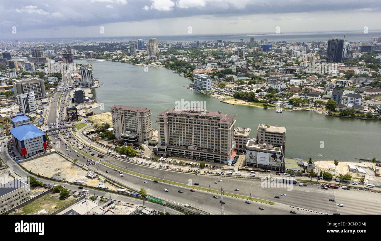 Aerial view of modern skyscrapers and bustling highways mirroring in ...