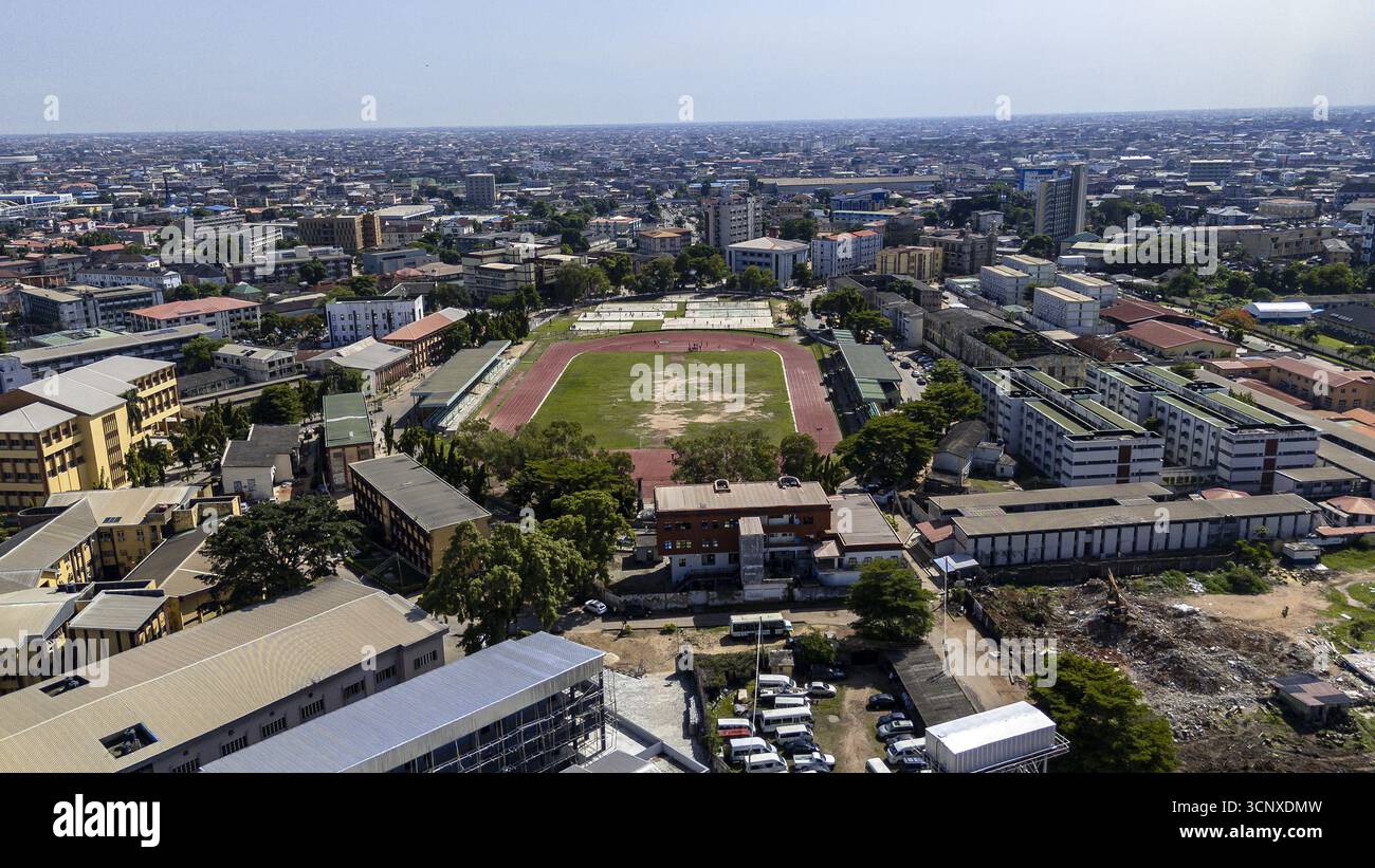 Aerial view of a sports field surrounded by buildings, creating a ...