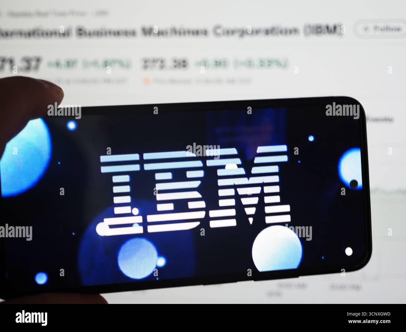In this photo illustration, an International Business Machines ...