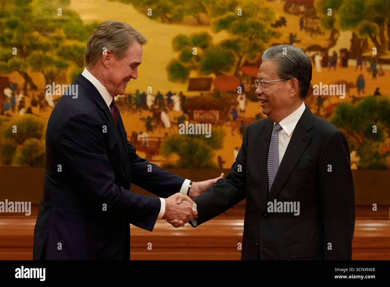 U.S. Ambassador to China David Perdue, left, shakes hands with Zhao ...