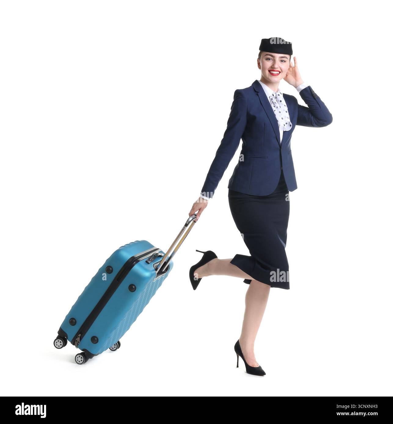 Positive stewardess with suitcase on white background Stock Photo - Alamy