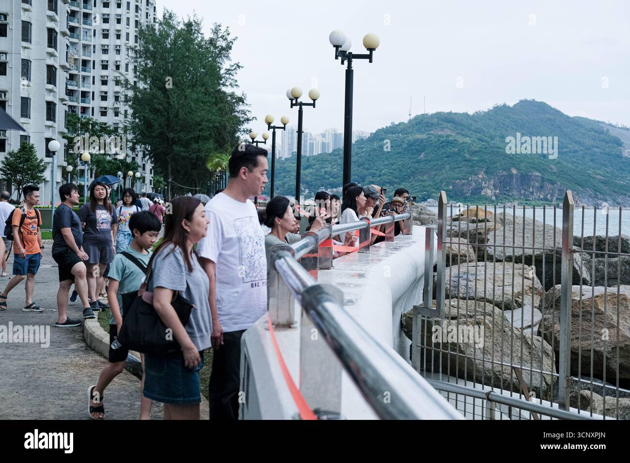 September 23, 2025, Hong Kong, China: People take photos by the ...
