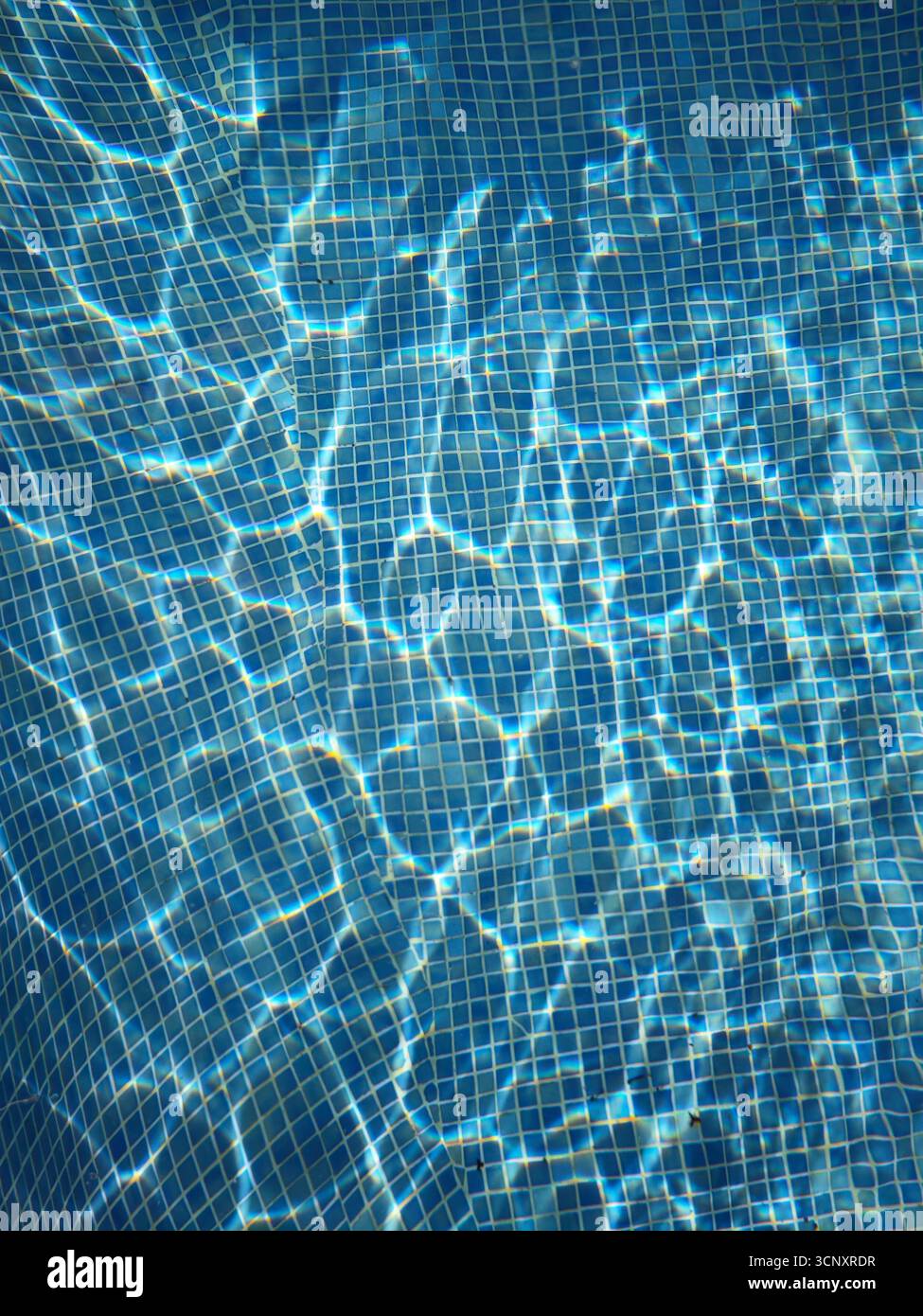 Reflections of light on the water of a swimming pool Stock Photo - Alamy