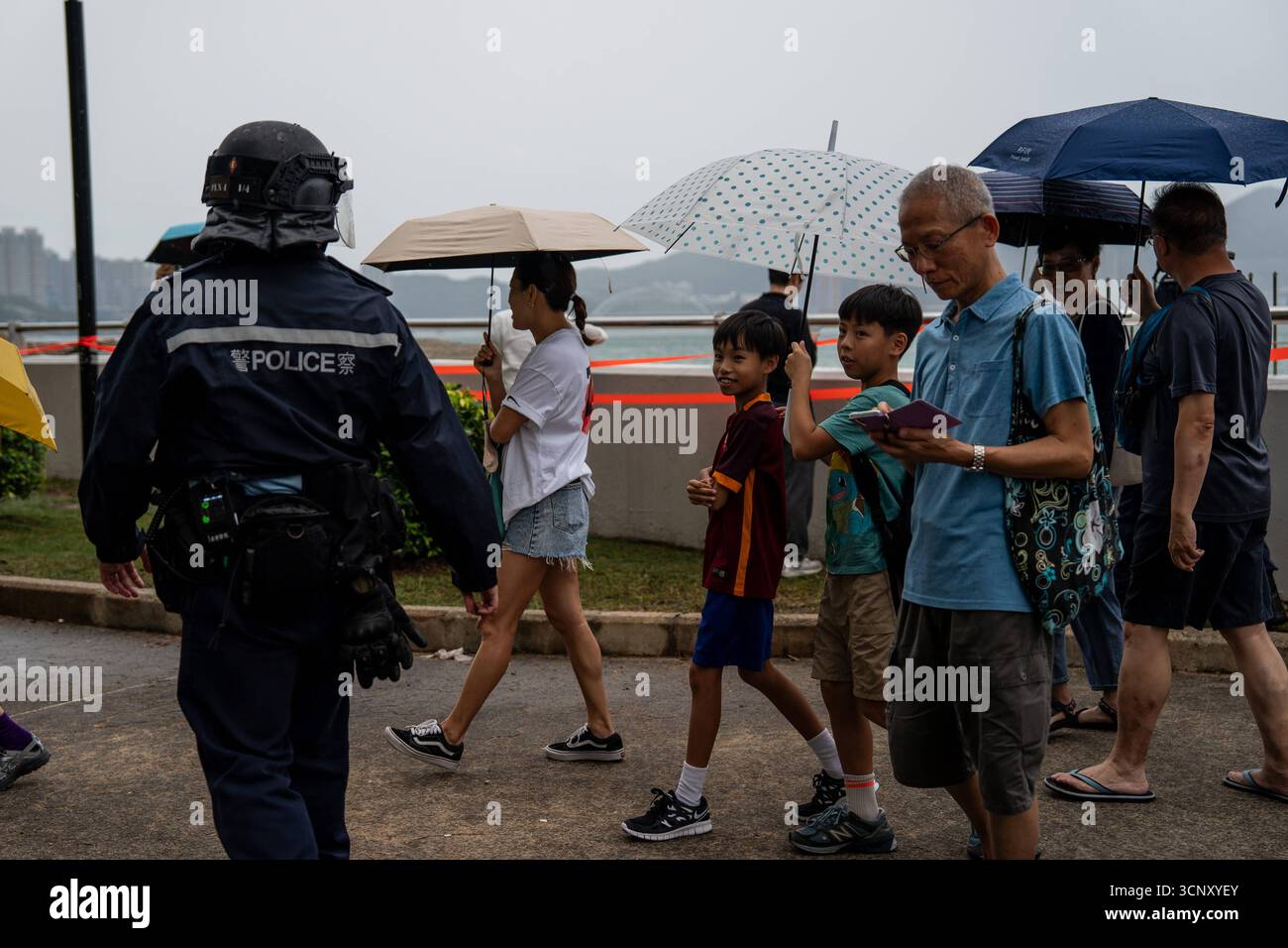 Hong Kong During Typhoon Ragasa Police officers asking people to leave ...