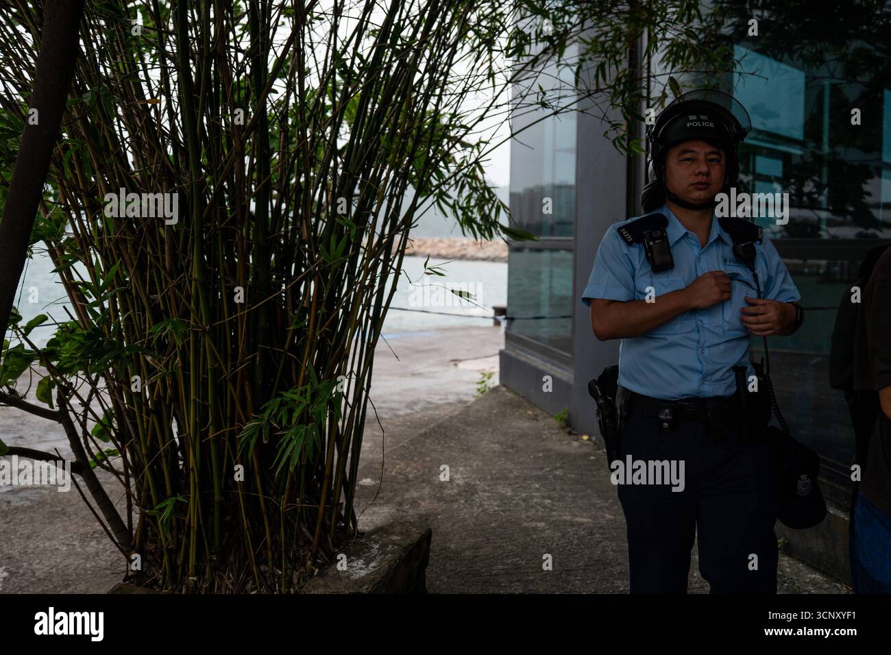 Hong Kong During Typhoon Ragasa A police officers stands guard near the ...