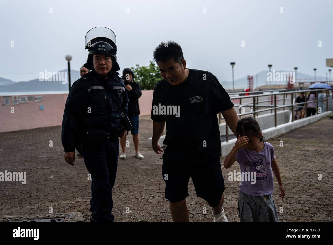Hong Kong During Typhoon Ragasa Police officers asking people to leave ...