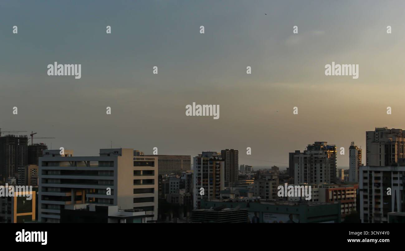 City skyline under a clear sky with modern buildings Stock Photo - Alamy