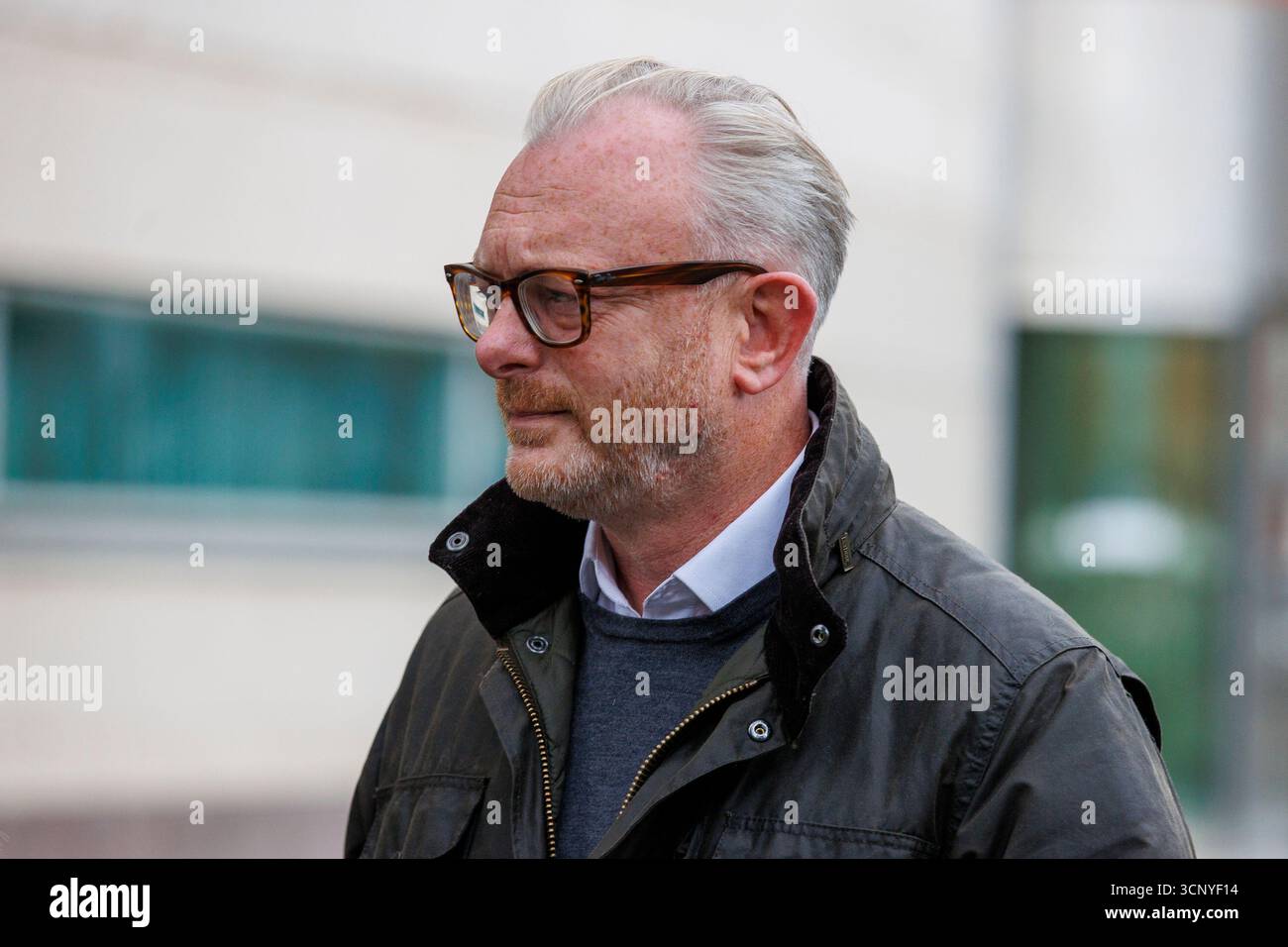Ian Coulter leaves Belfast Crown Court, where he and Frank Cushnahan ...