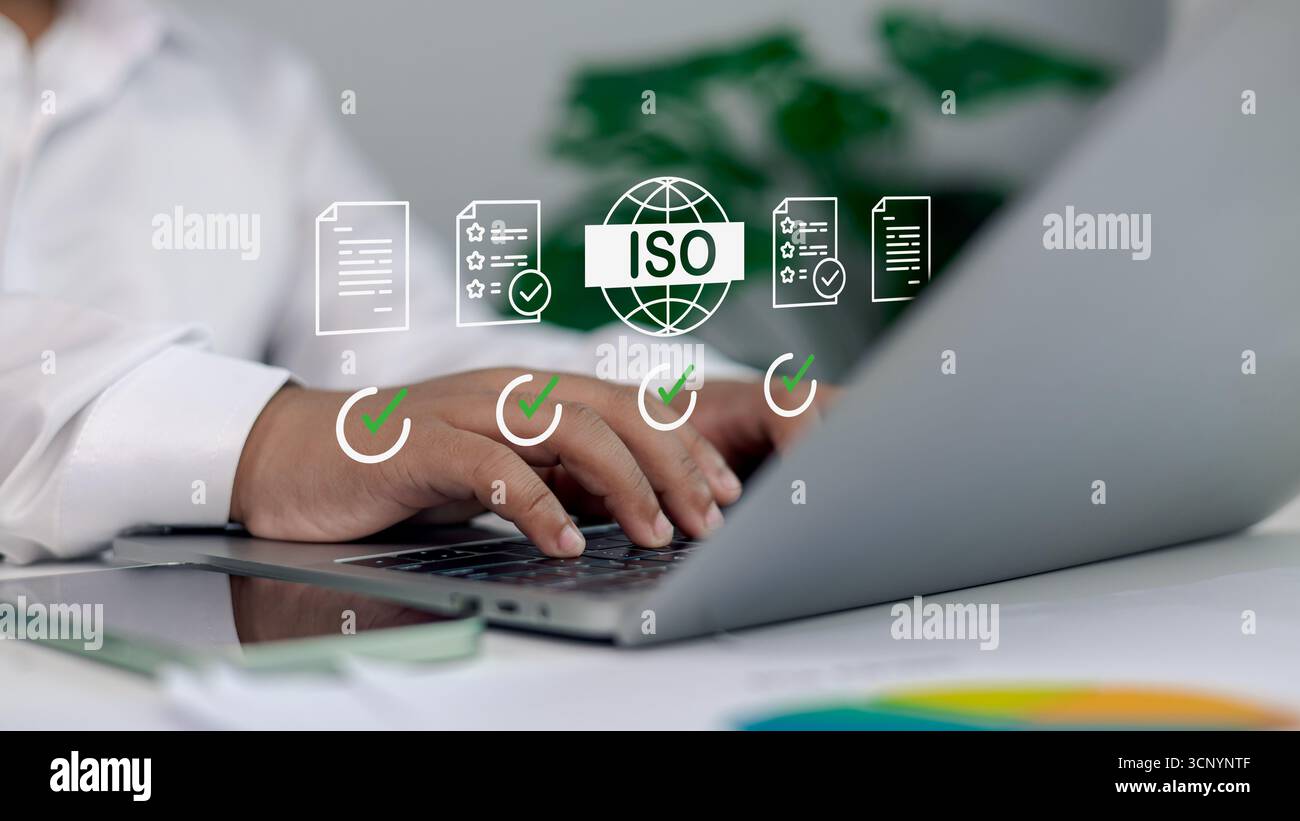 Close up of businessman typing on laptop with ISO certification icons ...