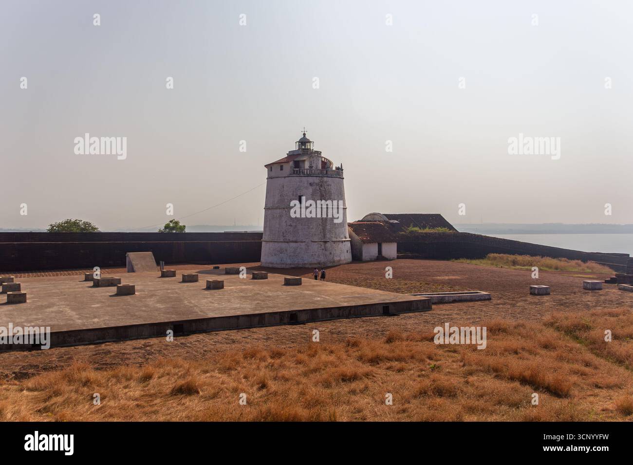 Historic Aguada Fort Lighthouse overlooking Goan sea Stock Photo - Alamy