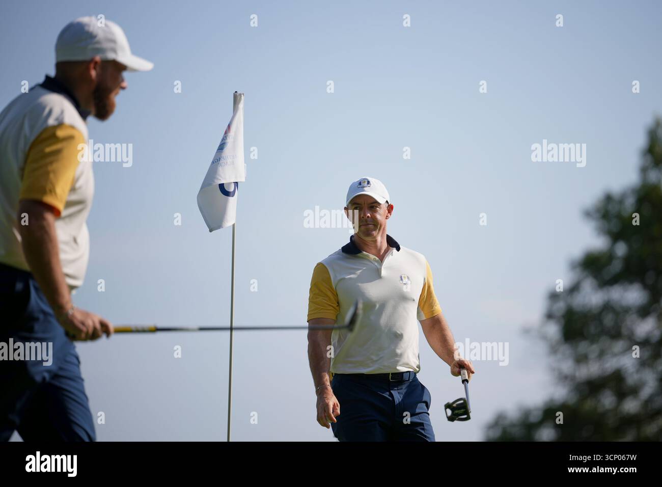 Europe's Shane Lowry and Rory McIlroy talk on the green at the third ...