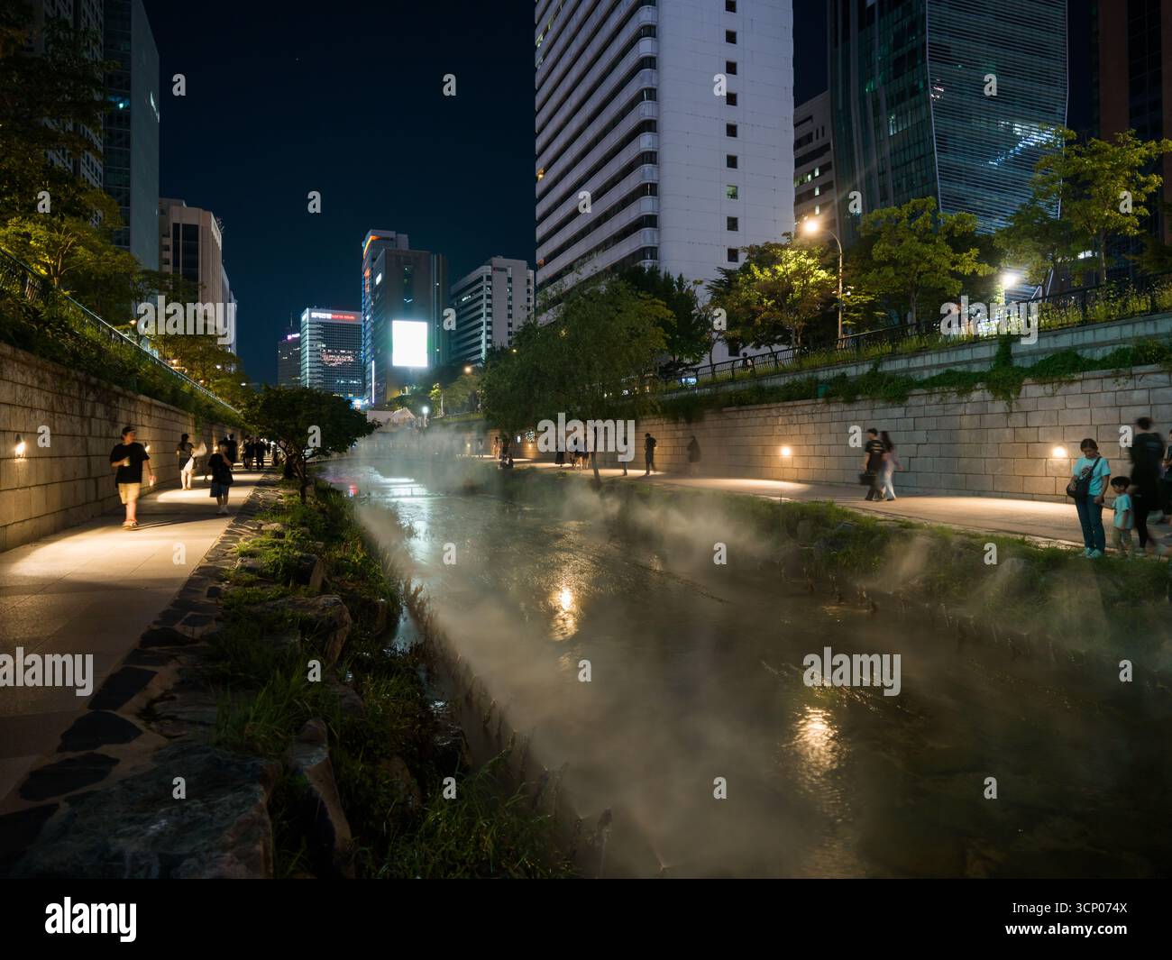 Cheonggyecheon Stream at night with illuminations and public library ...
