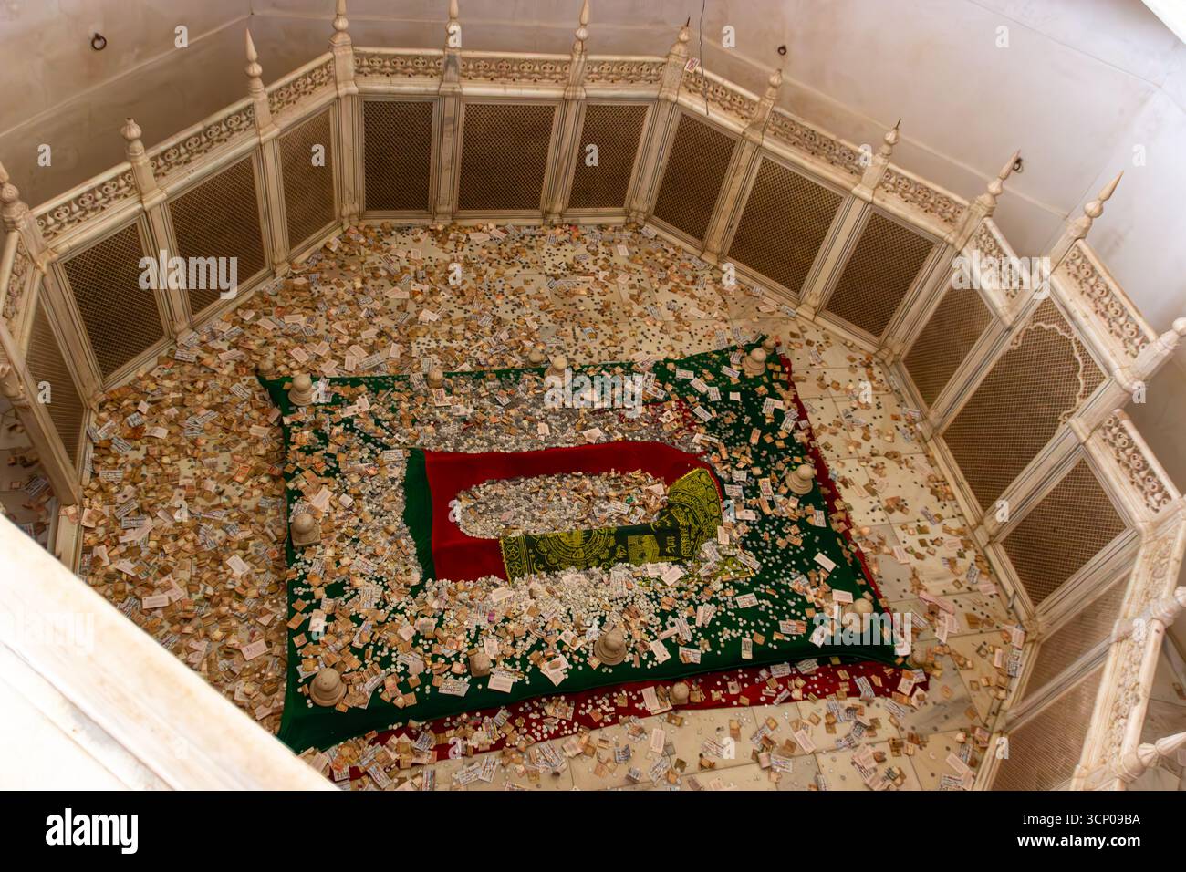 Tomb Covered with Offerings and Currency Notes Stock Photo - Alamy